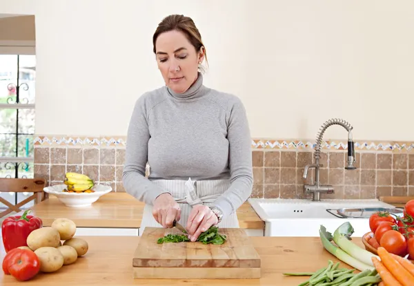 Woman cooking vegetables - Stock Image - Everypixel