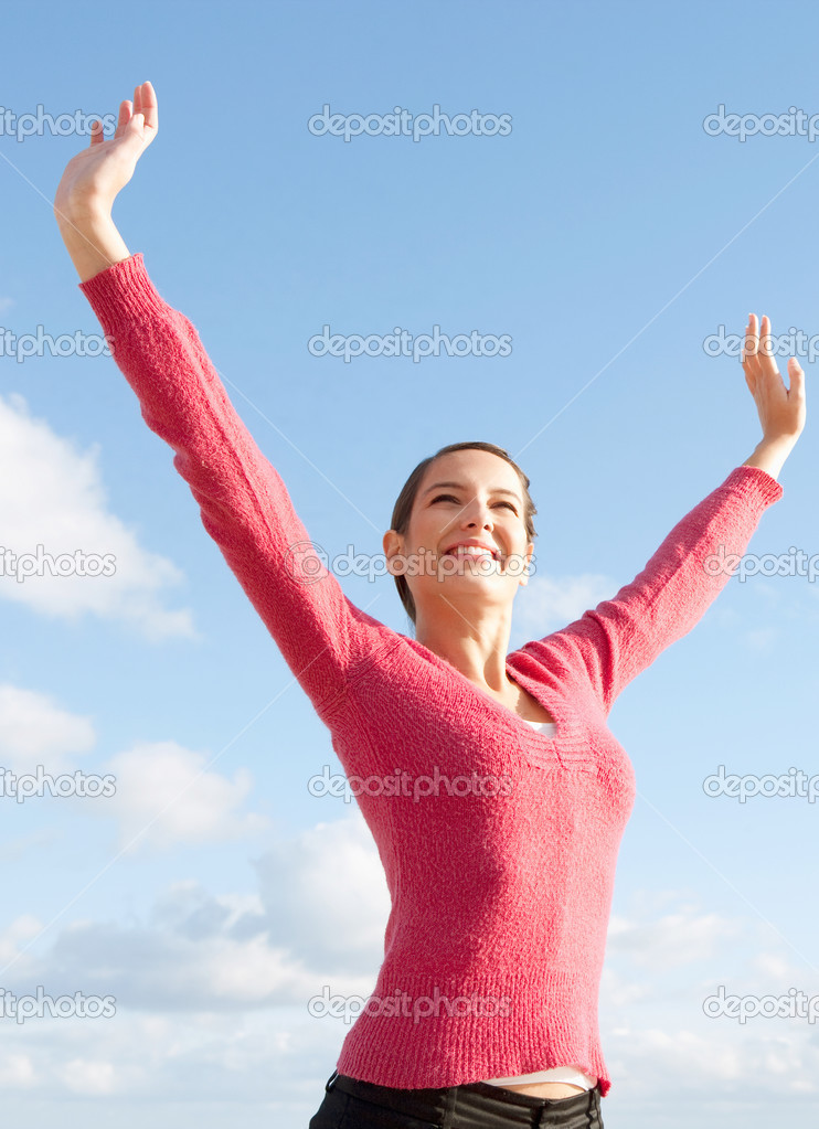 Woman standing with her arms outstretched Stock Photo by ©mjth 48318227