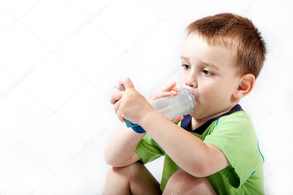 Little boy using inhaler for asthma isolated on white background Stock ...