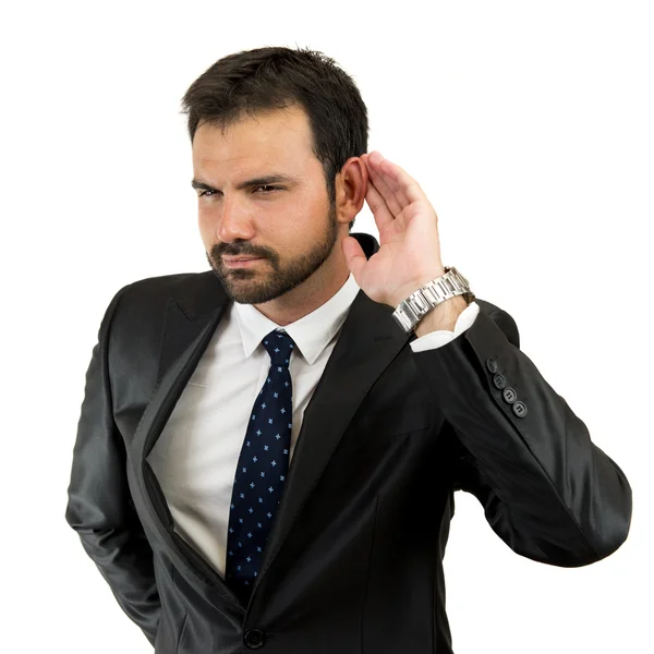 Young business man hearing something over white background — Stock ...