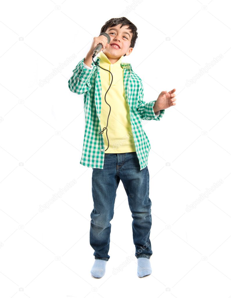 Kid singing over white background Stock Photo by ©luismolinero 43906403