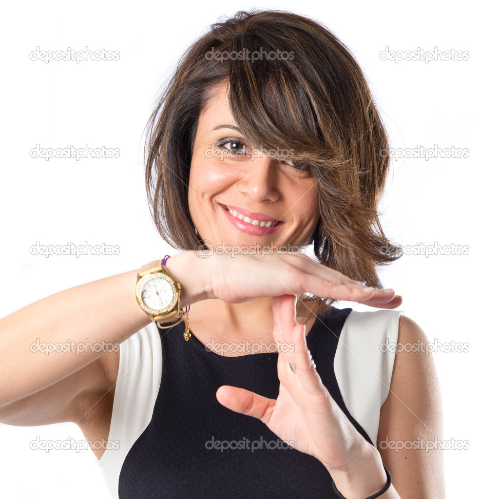 Pretty woman making time out gesture over white background Stock Photo ...