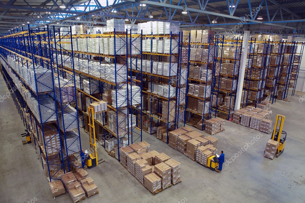 Interior large warehouse with freight stacked high. — Stock Editorial ...