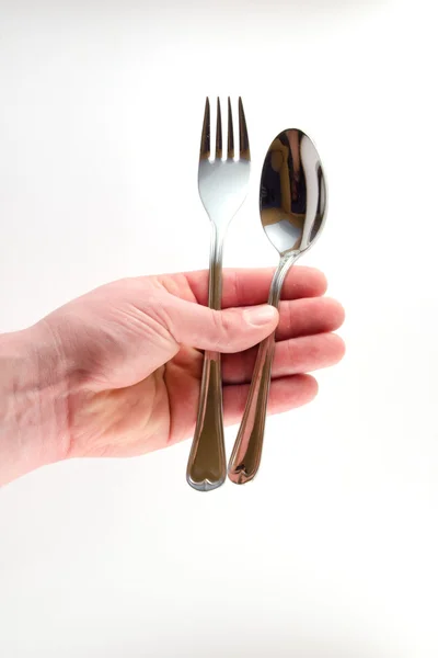 Hand holding fork and knife Stock Photo by ©ia__64 5705289