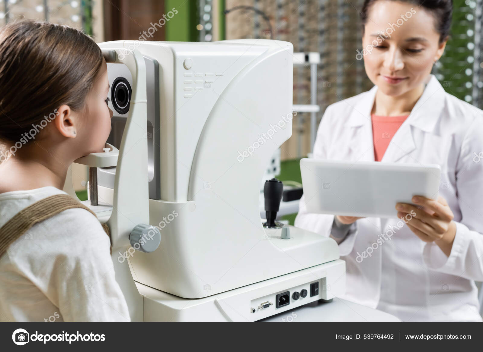 Positive Optometrist Looking Digital Tablet While Measuring Vision Girl ...