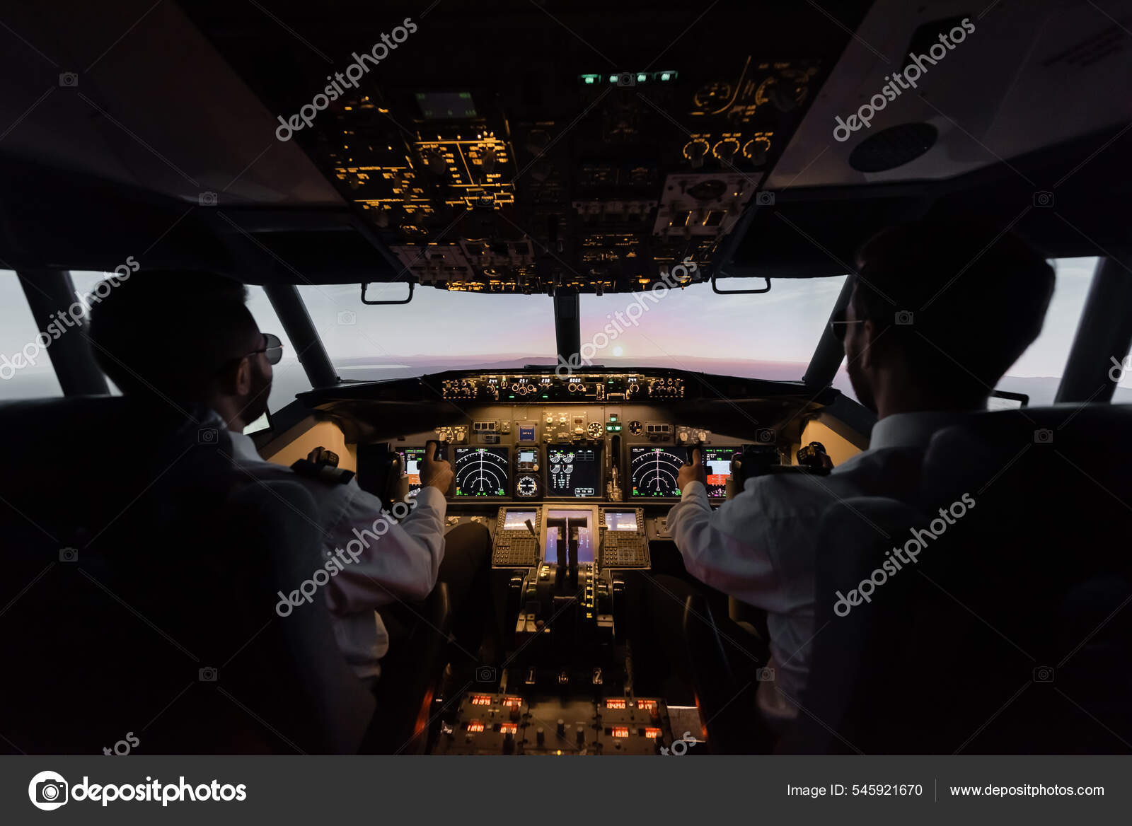 Back View Professionals Piloting Modern Airplane Stock Photo by ...