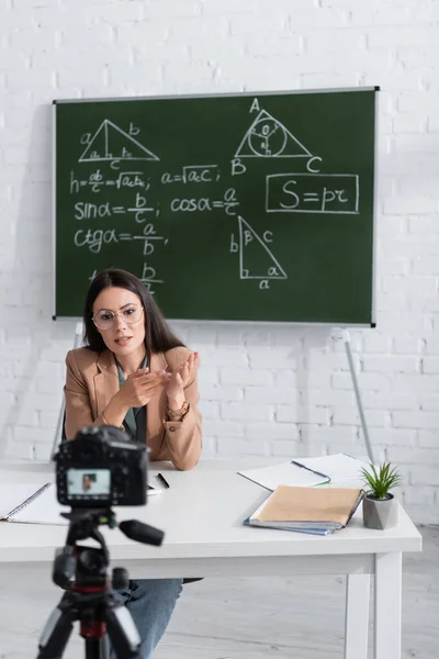 Teacher Pointing Math Formulas Chalkboard Holding Laptop Online Lesson ...