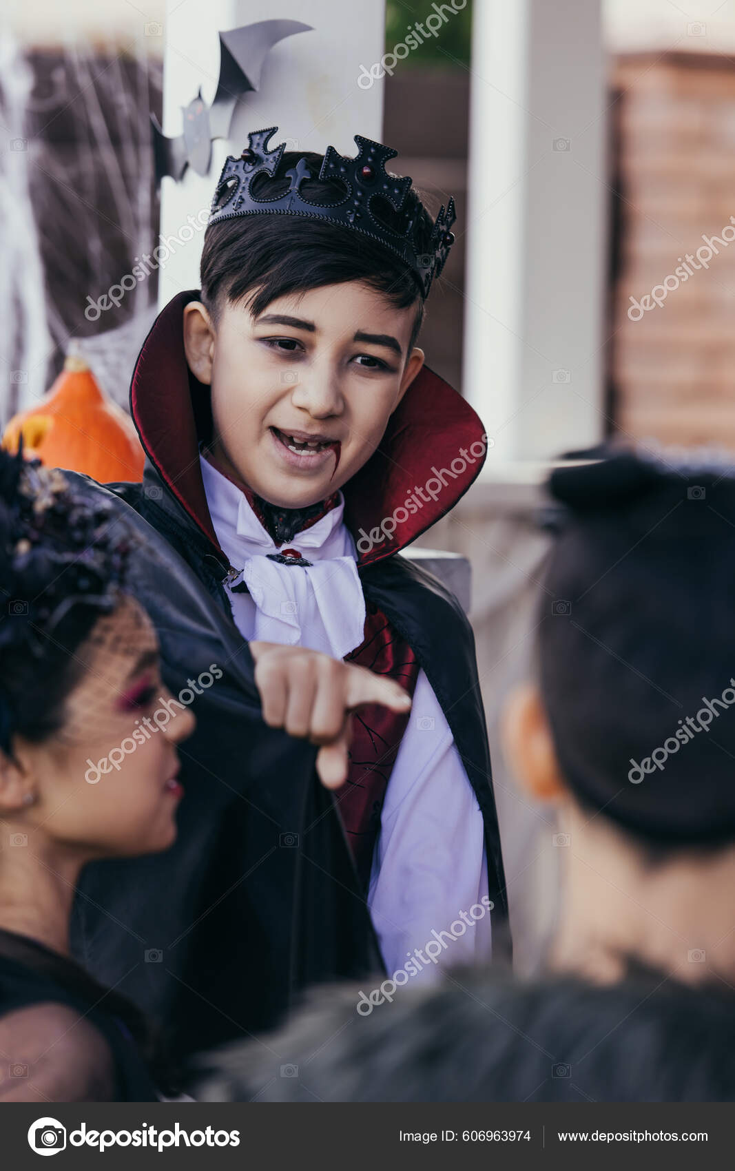 Asian Boy Halloween Vampire Costume Pointing Finger Blurred Friends ...