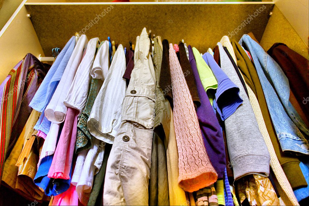 Clothes in wardrobe Stock Photo by ©photosky 20985407