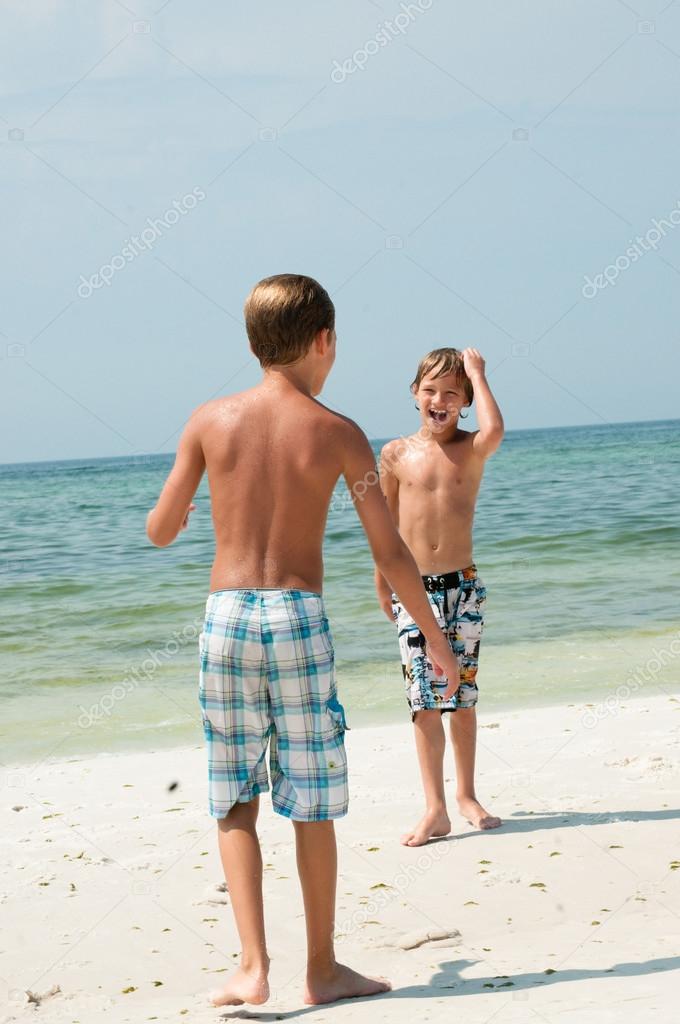Two young boys on the beach — Stock Photo © tammykayphoto #20092099