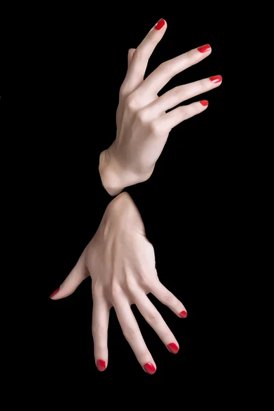 Pretty woman hand with perfect painted nails isolated on black ...