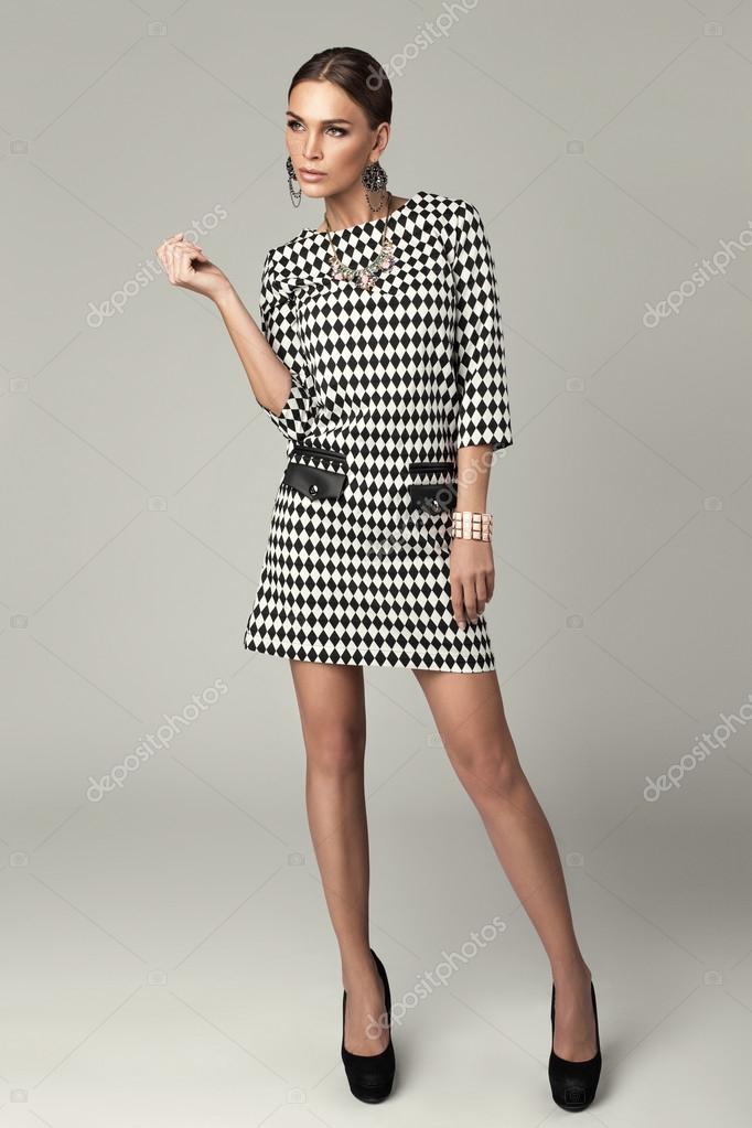 Sexy model on grey background Stock Photo by ©kiuikson 44757739