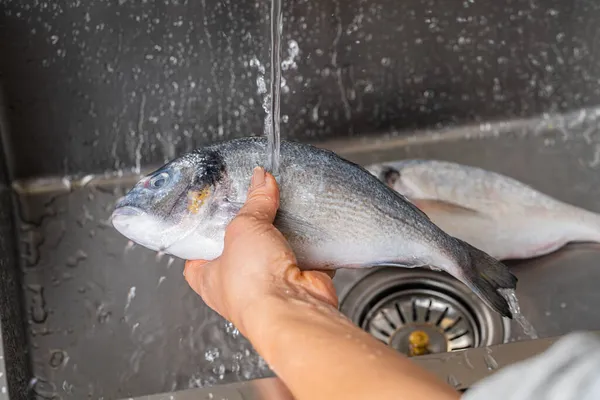 Fish cleaning process Stock Photos, Royalty Free Fish cleaning process ...