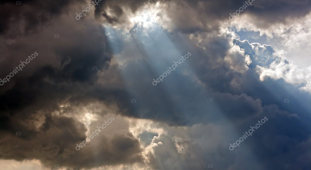 Sun rays through storm clouds Stock Photo by ©illu 21033033
