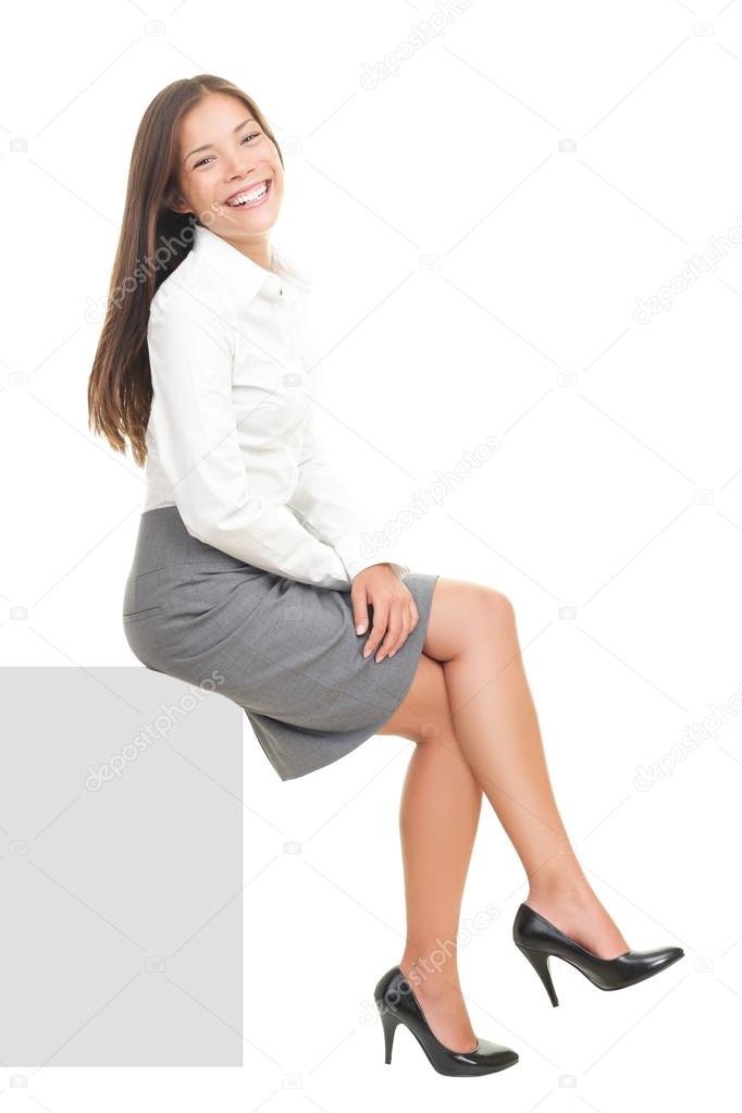 Business woman sitting on blank sign Stock Photo by ©Maridav 22310207