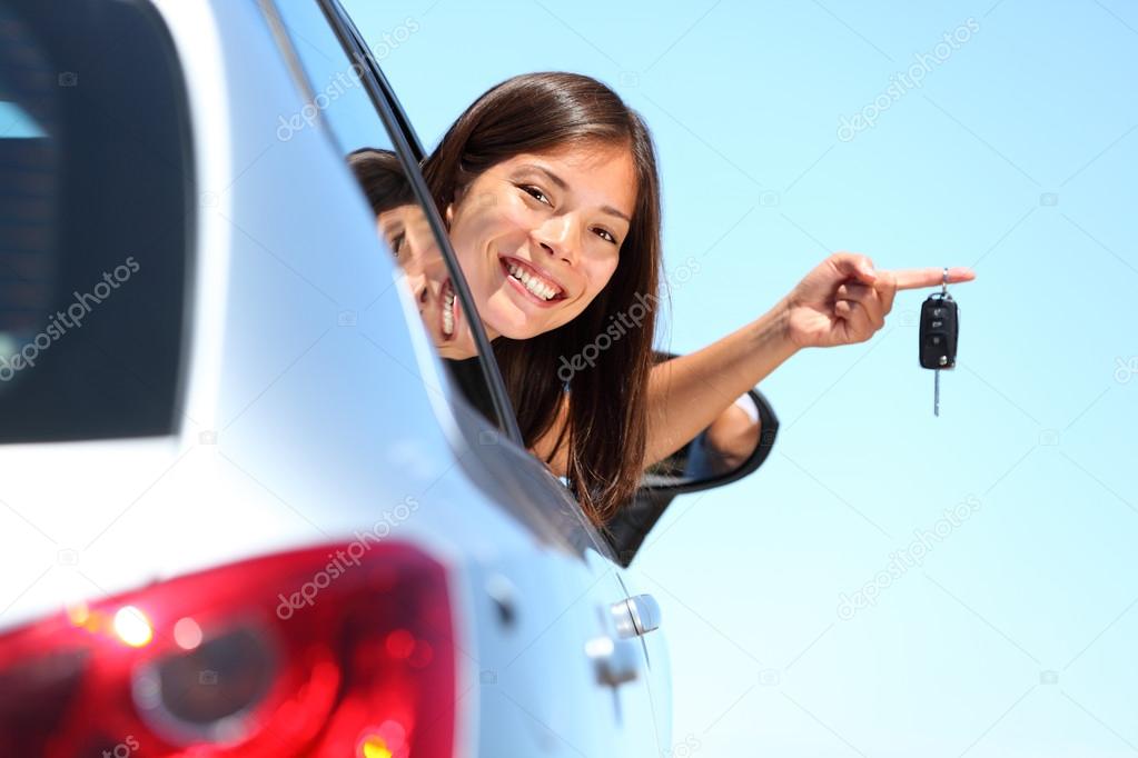 Driver woman showing new car keys — Stock Photo © Maridav #22312685