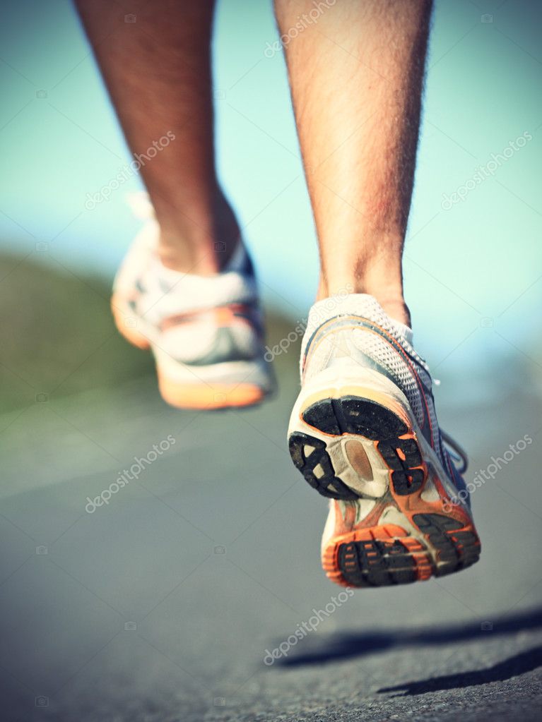 Runnning shoes on runner — Stock Photo © Maridav #24537671