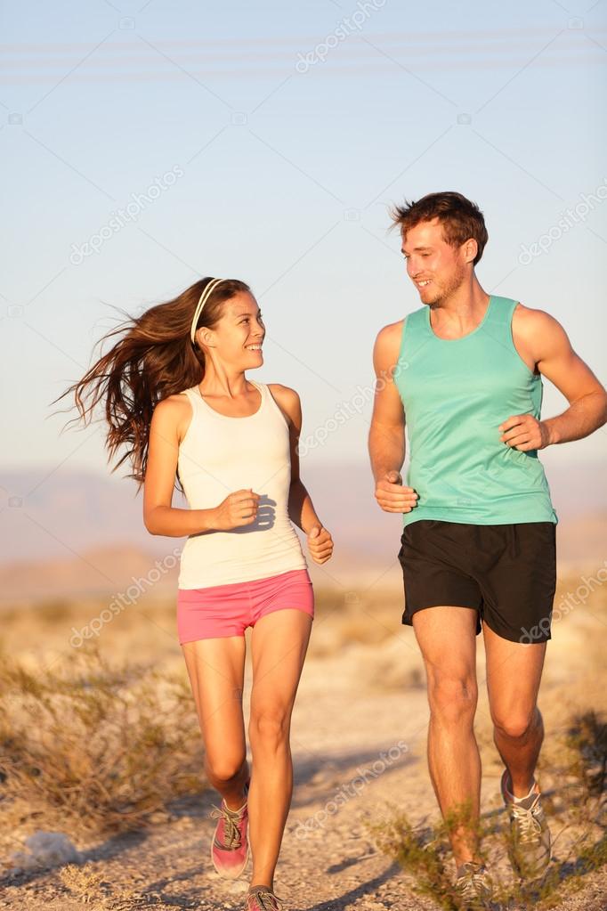 Runners - Active fitness couple running laughing — Stock Photo ...