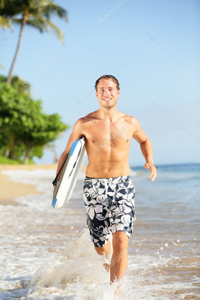 Beach lifestyle - man surfer with surfboard Stock Photo by ©Maridav ...