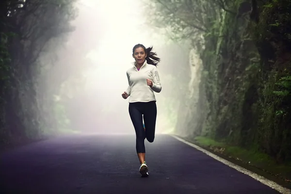 Woman running on road - Stock Image - Everypixel