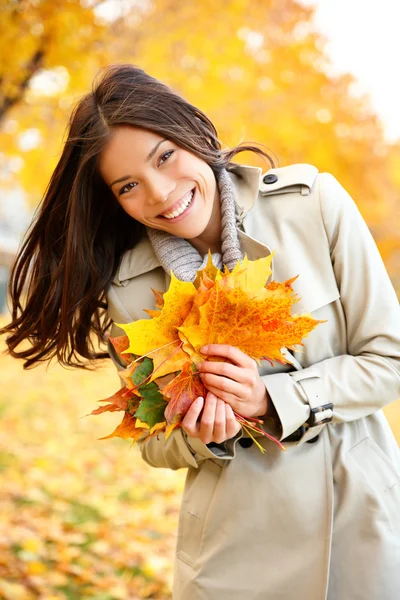 Fall woman playing with leaves Stock Photo by ©Maridav 24537677