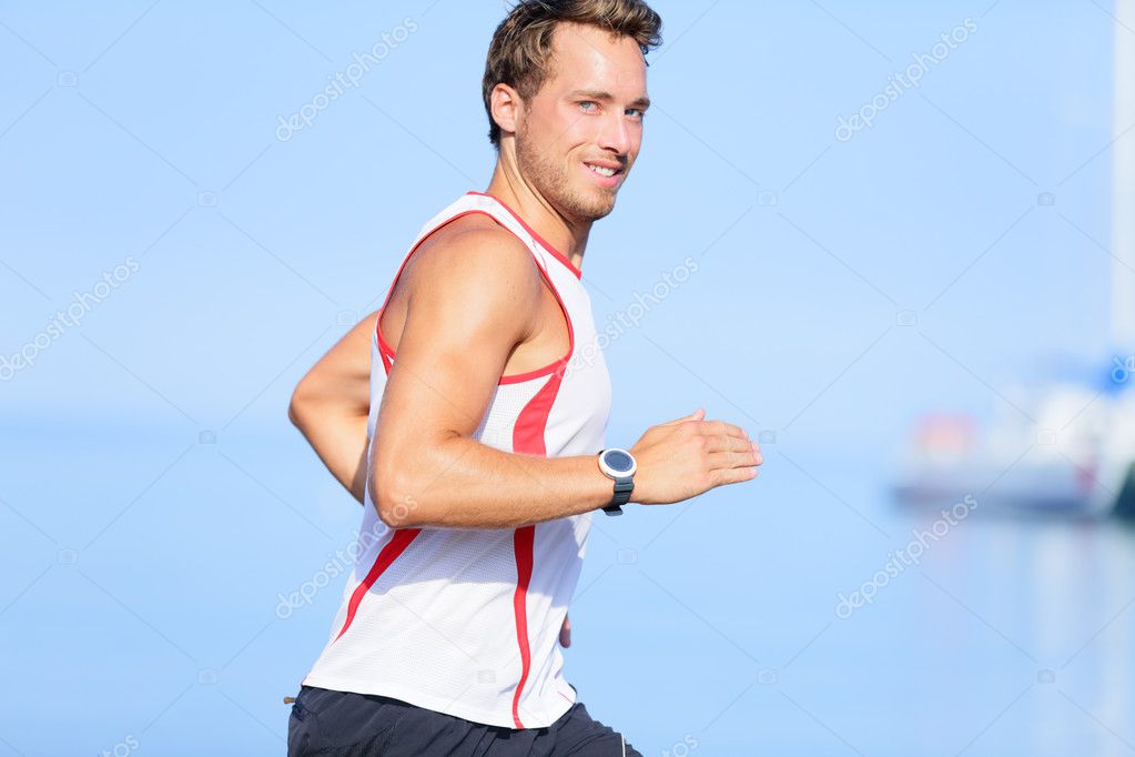 Running man runner looking at camera smiling — Stock Photo © Maridav ...