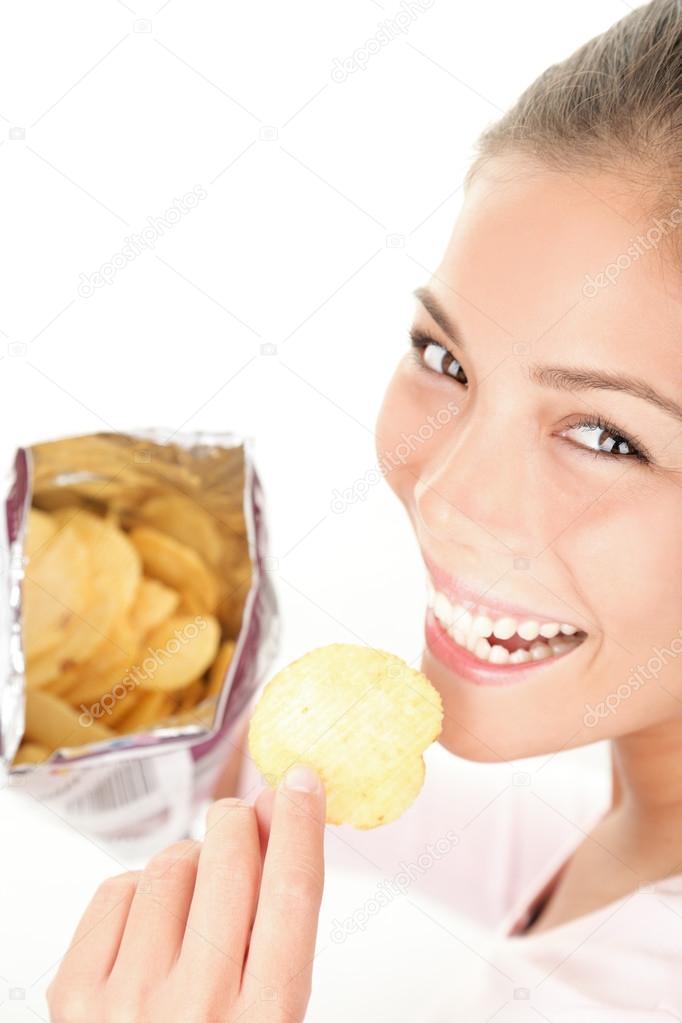 Woman eating chips — Stock Photo © Ariwasabi #22927190