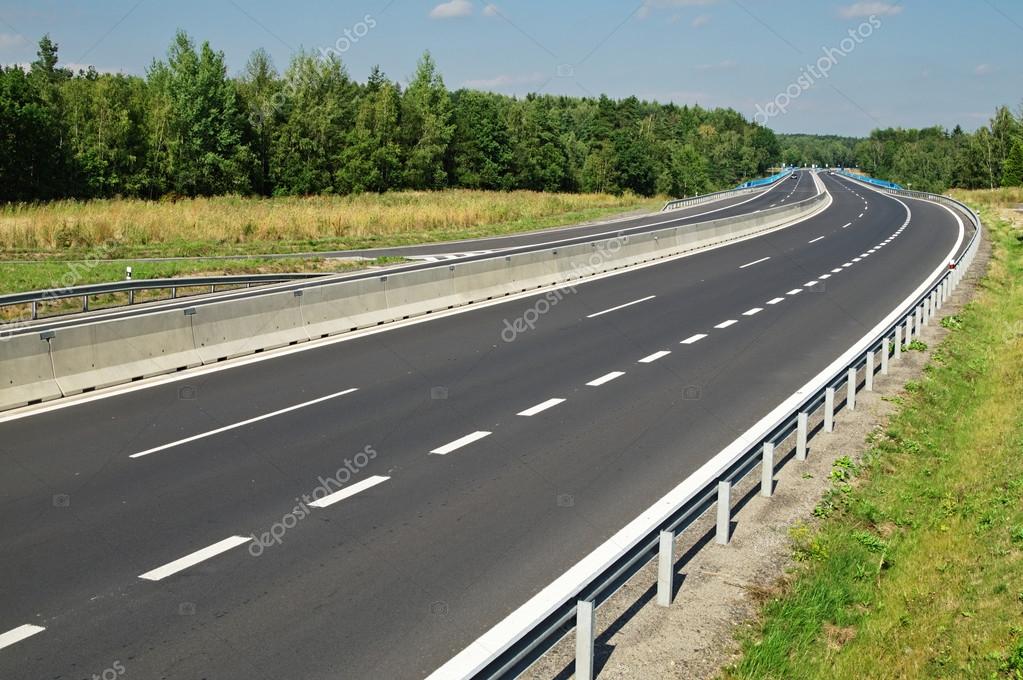 Empty highway disappearing into the trees in the forest ⬇ Stock Photo ... Empty highway disappearing into the trees in the forest ⬇ Stock Photo ...