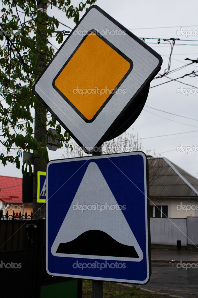 Main road and Speed bump signs — Stock Photo © Alex_Schmidt #44574297