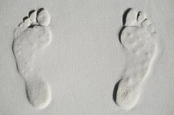 Two pairs footstep on the beach — Stock Photo © Molbert #23350708