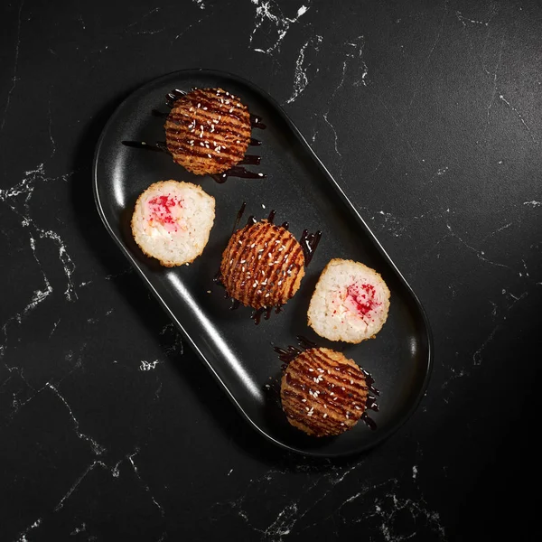 Rice croquettes with tiger shrimp. Cheese cream, tobiko caviar, tiger ...