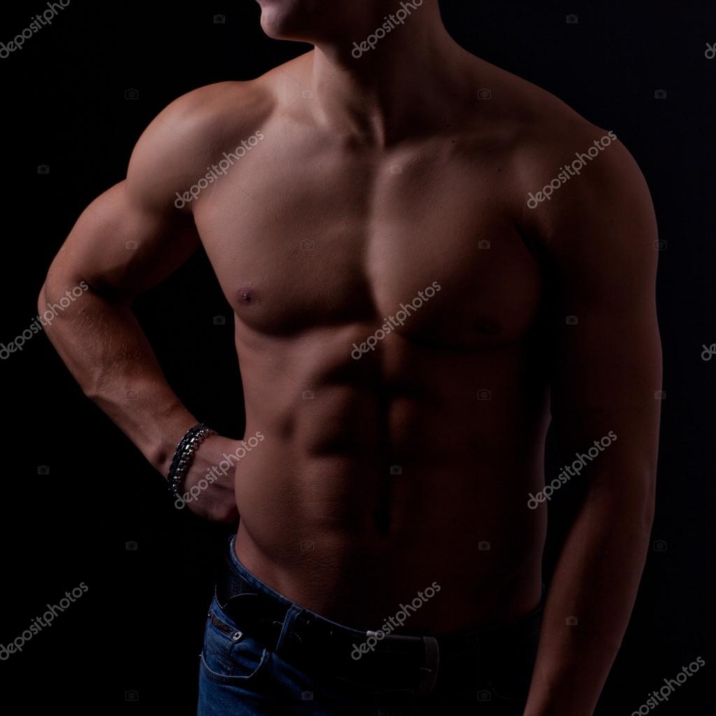 Perfect male body on black background. Stock Photo by ©MaxFrost 33619285