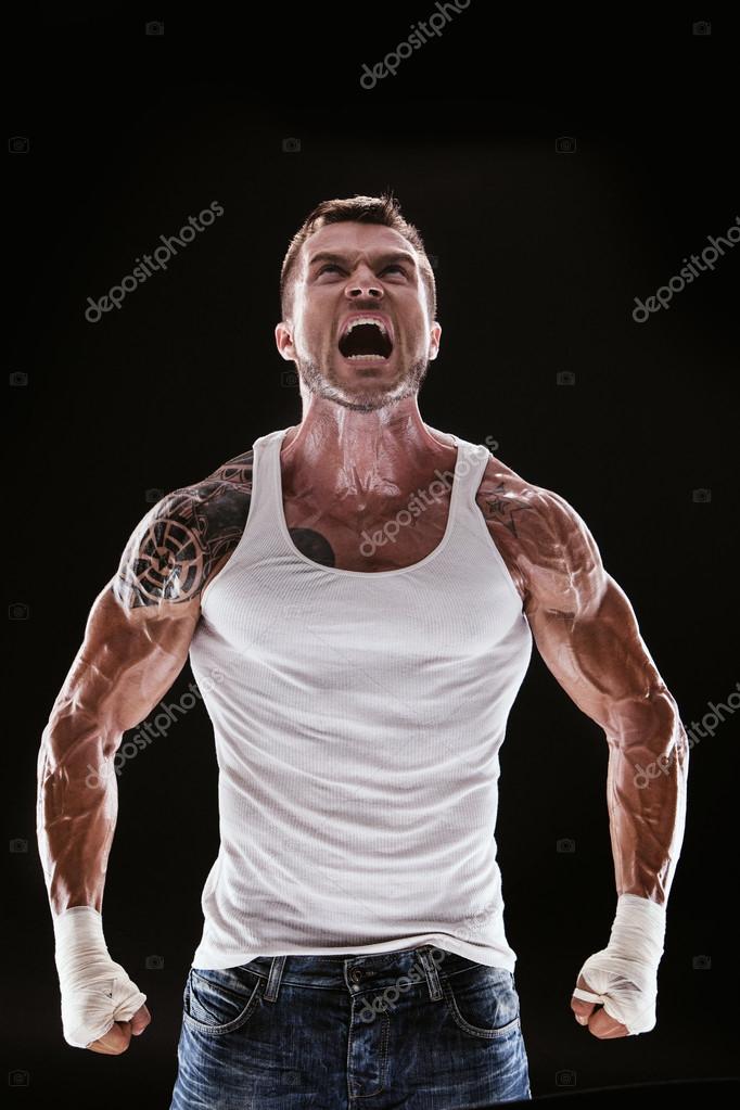 Muscular man screaming and roar — Stock Photo © Anidimi #51788005