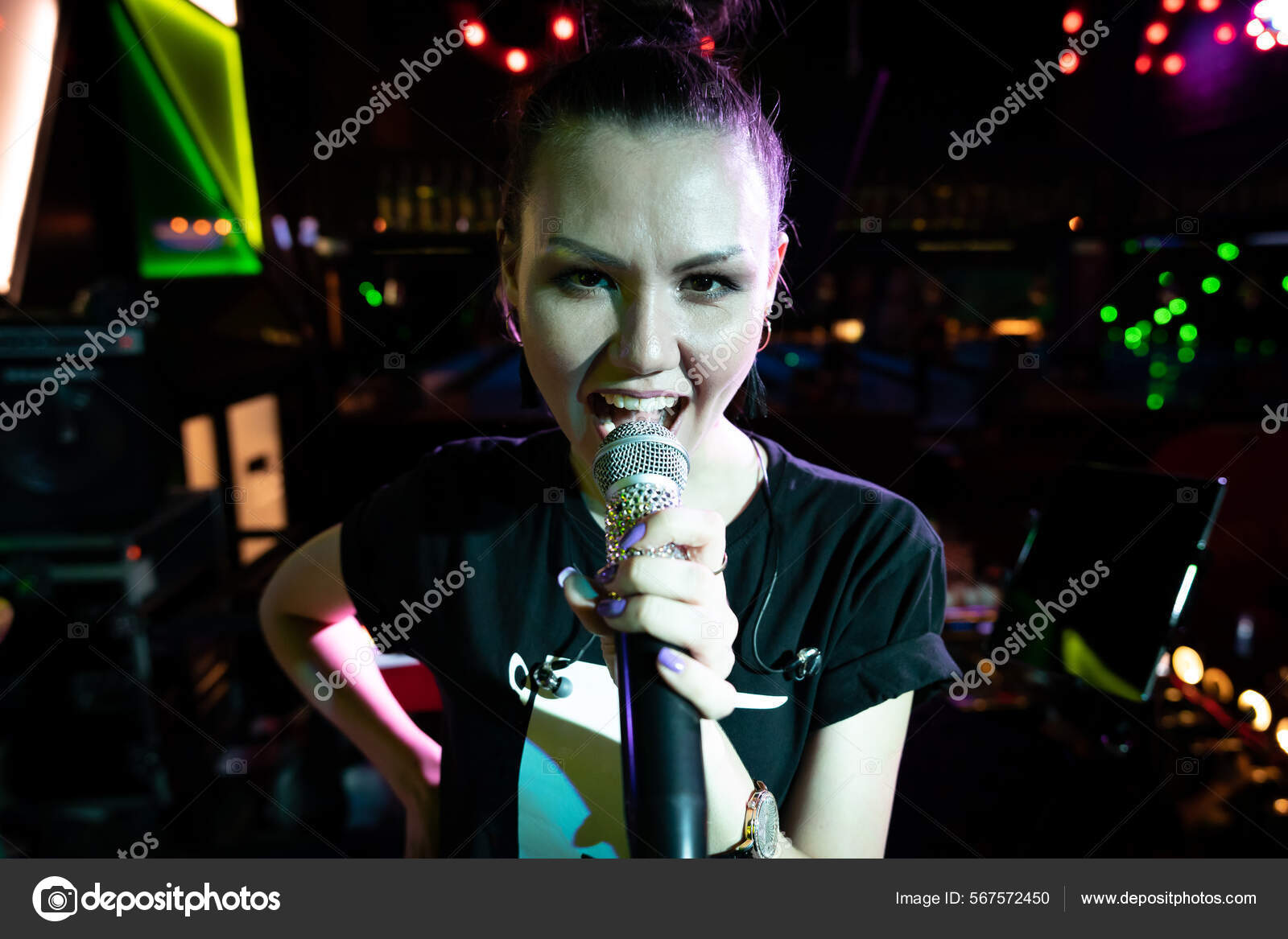 Young singing woman with a microphone live band vocalist Shake it band ...