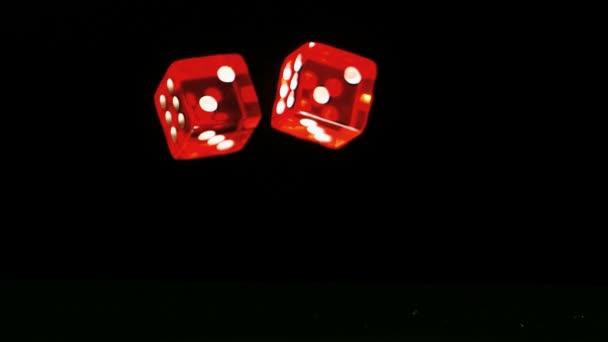 Two red dice falling and bouncing close up on black background ⬇ Video ...