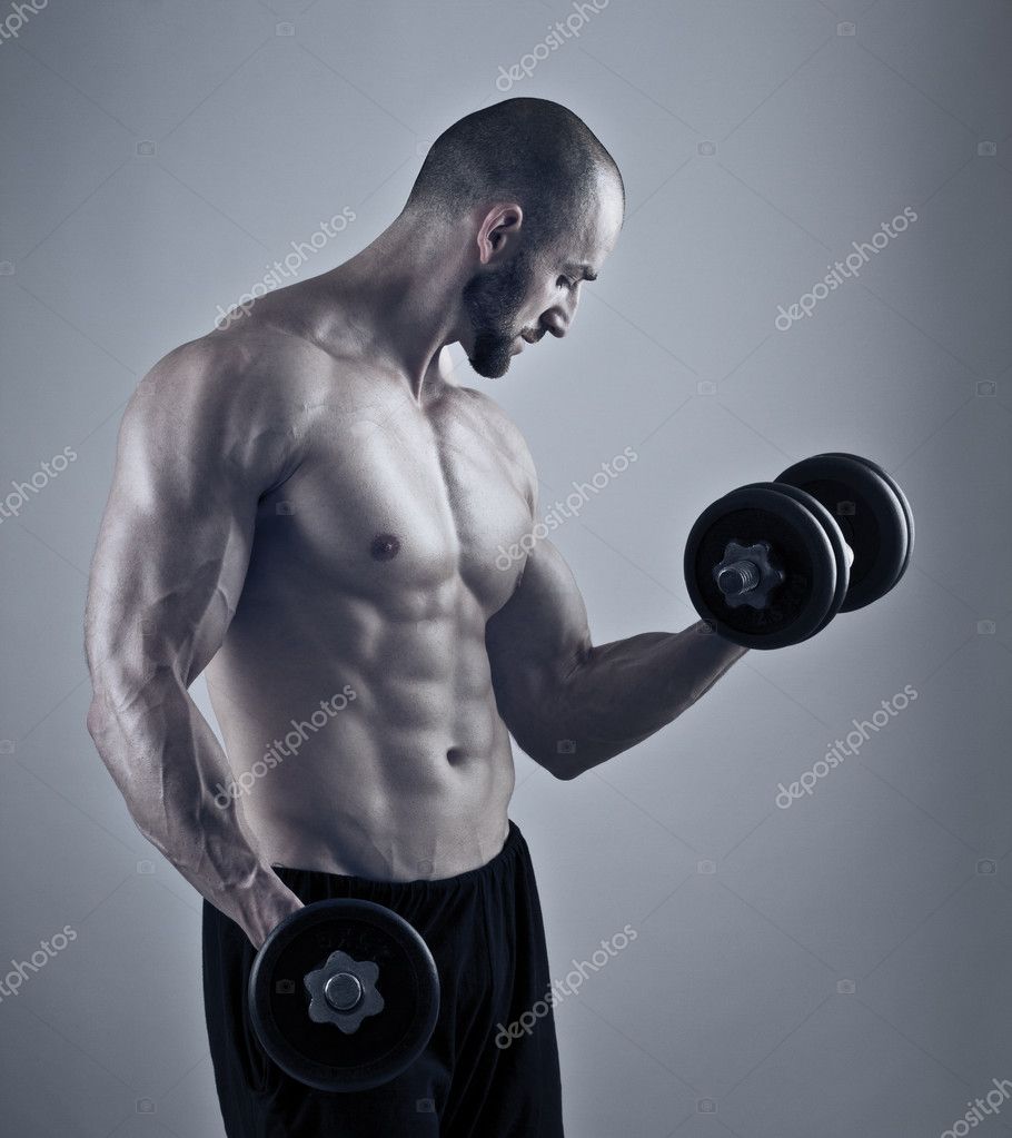 Muscular man workout with dumbbells Stock Photo by ©miljan010 21853161