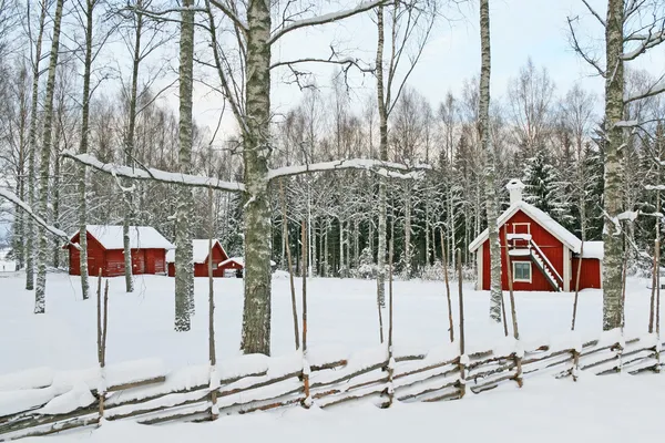 Swedish winter landscape with red wooden houses - Stock Image - Everypixel