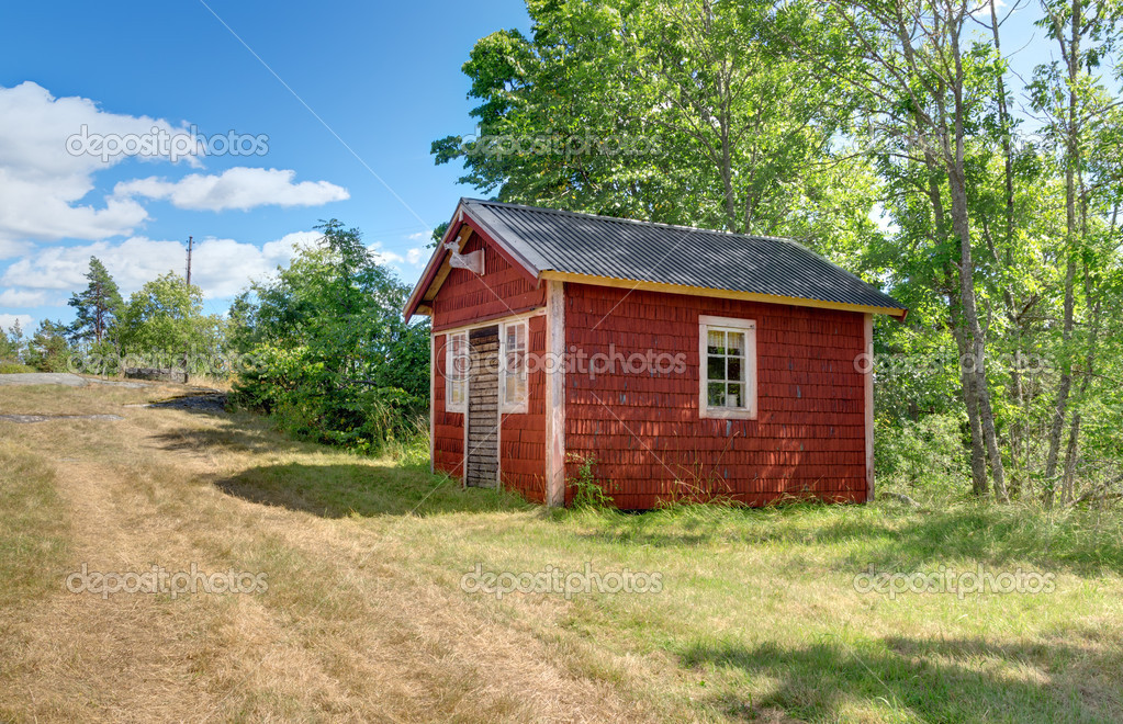 Traditional Swedish cabin painted in red color Stock Photo by ...