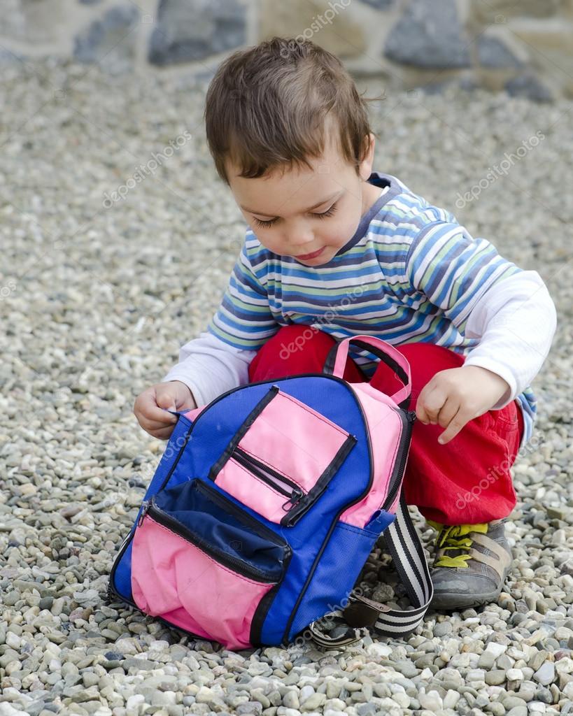 Child opening his bag Stock Photo by ©pavsie 43669707