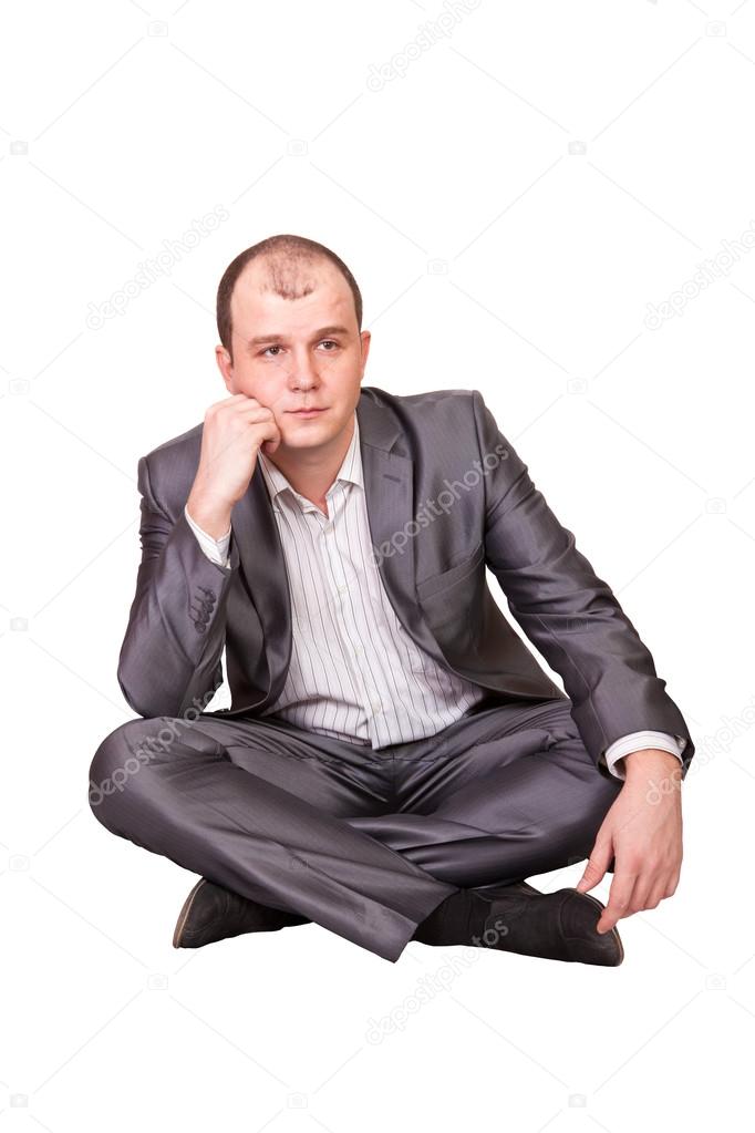 A man sits cross-legged — Stock Photo © Toomler #22885590