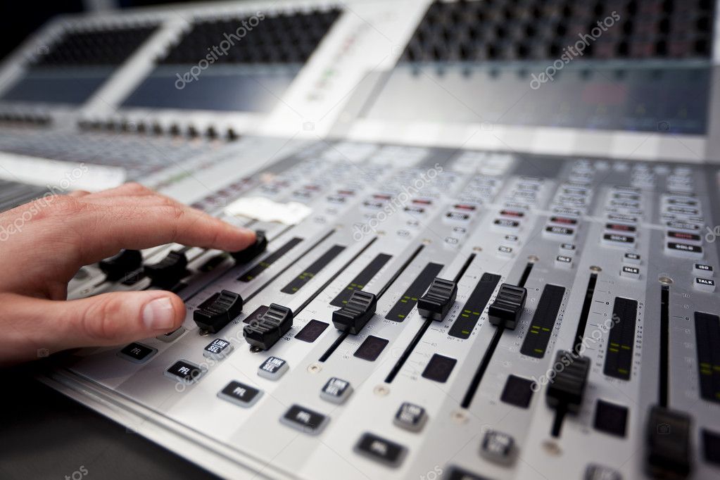 Hand on a sound fader in Television Gallery — Stock Photo © antb #21687645