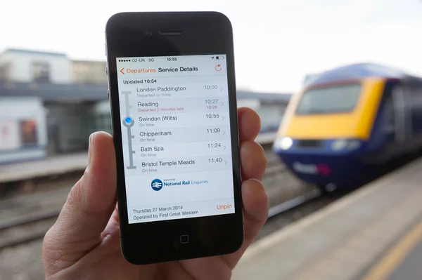 Using a UK Train Timetable App – Stock Editorial Photo © antb #22529115