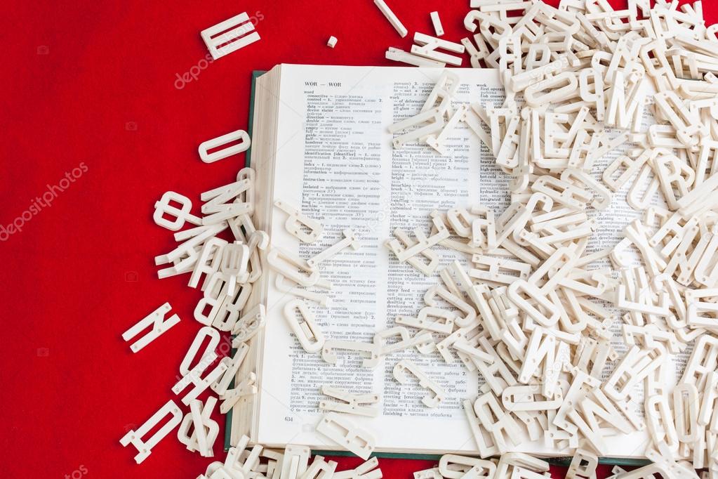 Letters are scattered on the book Stock Photo by ©Sergey7777 24768059