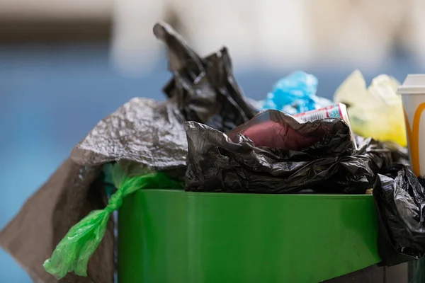 Overflowing Kitchen Trash Can