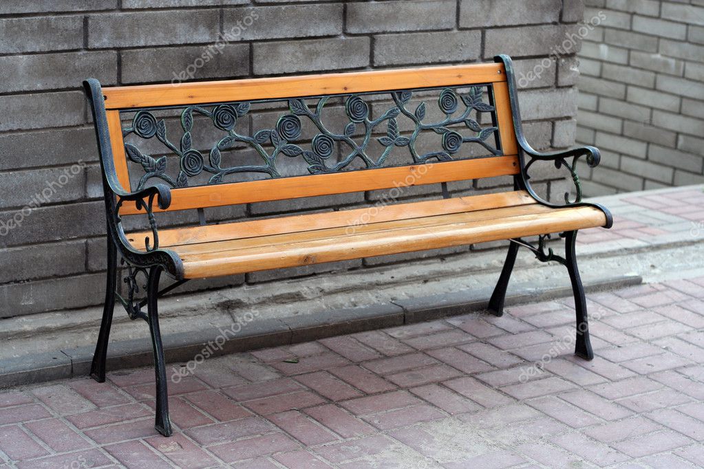 Wooden bench on the pavement road — Stock Photo © bluecaterpillar #25318297