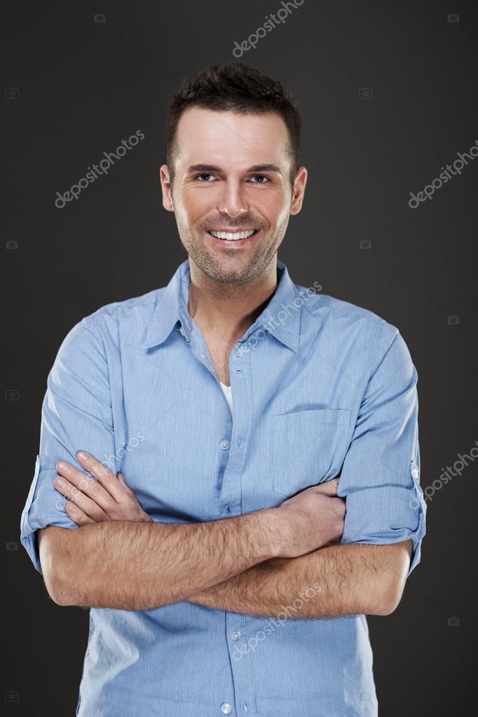 Cheerful man smiling — Stock Photo © gpointstudio #21953637 Cheerful man smiling — Stock Photo © gpointstudio #21953637