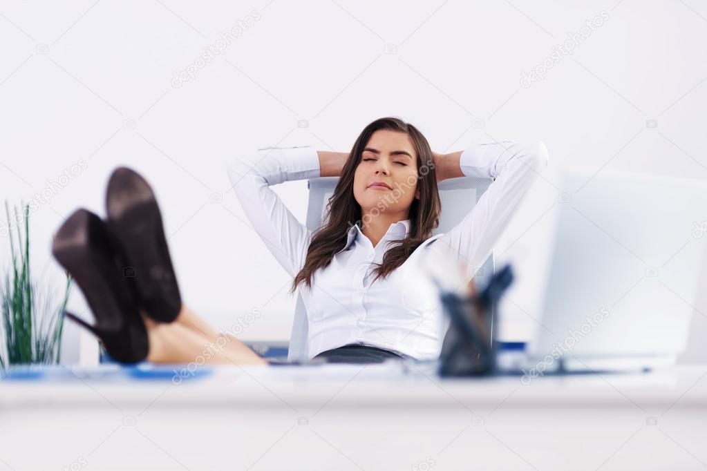 Businesswoman relaxing in office — Stock Photo © gpointstudio #23371638 Businesswoman relaxing in office — Stock Photo © gpointstudio #23371638