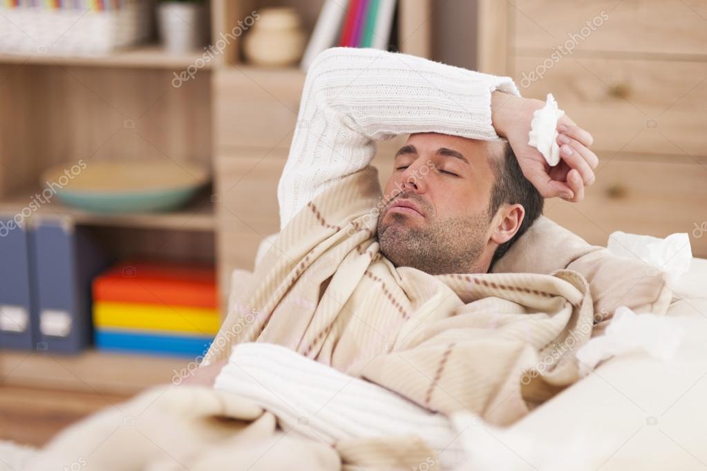 Sick man lying down — Stock Photo © gpointstudio #38142903