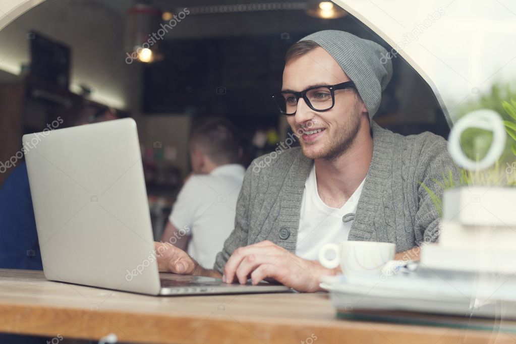 Hipster using laptop at cafe — Stock Photo © gpointstudio #46706673 Hipster using laptop at cafe — Stock Photo © gpointstudio #46706673