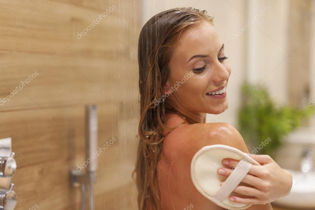 Woman taking shower — Stock Photo © gpointstudio #50922627